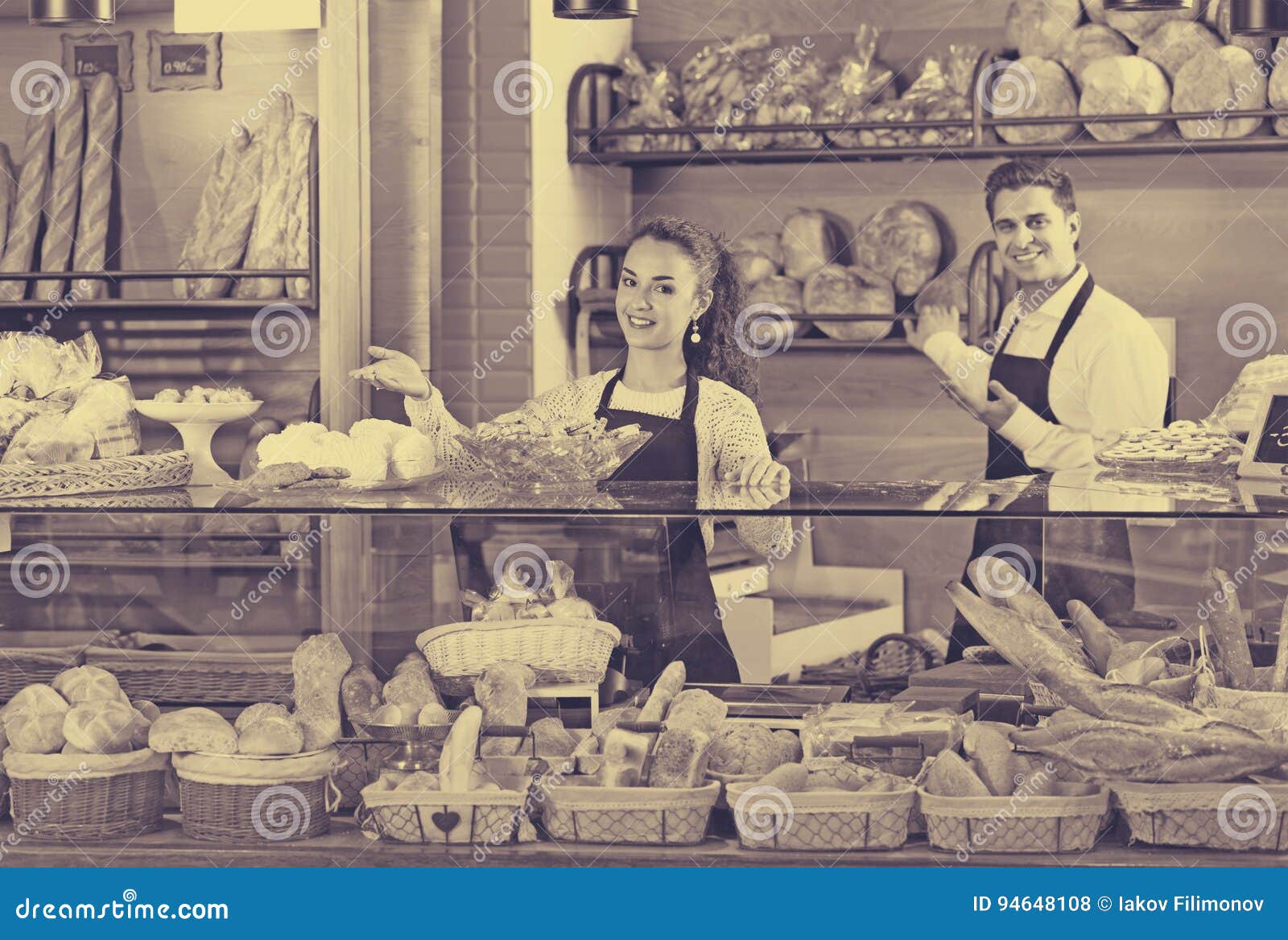 Portrait of Friendly Couple at Bakery Display with Pastry Stock Photo ...