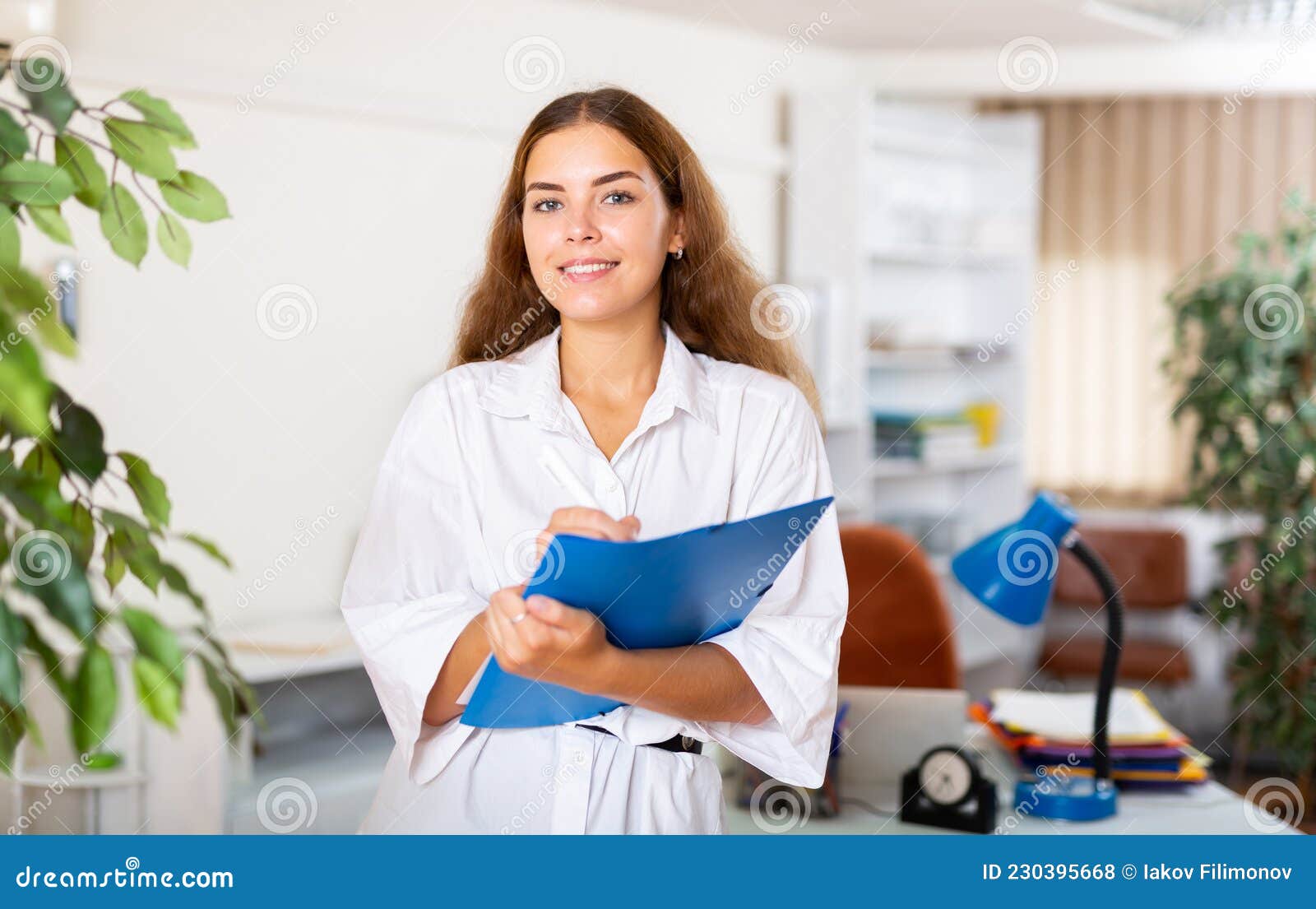 Friendly Female Administrative Secretary Writing Down Tasks in Office ...