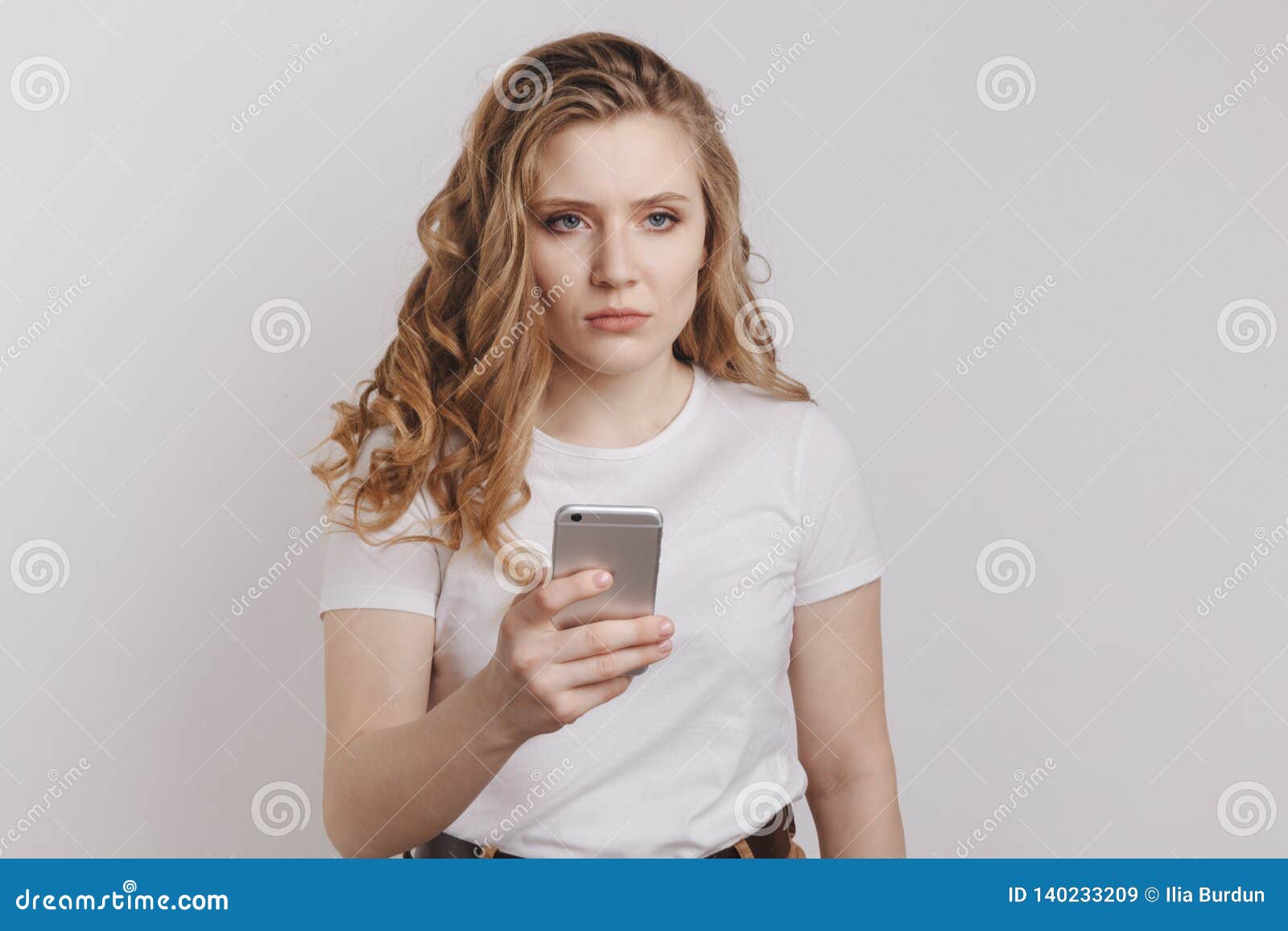 Portrait of Frustrated Girl with Her Phone. Problems with Cellphone ...