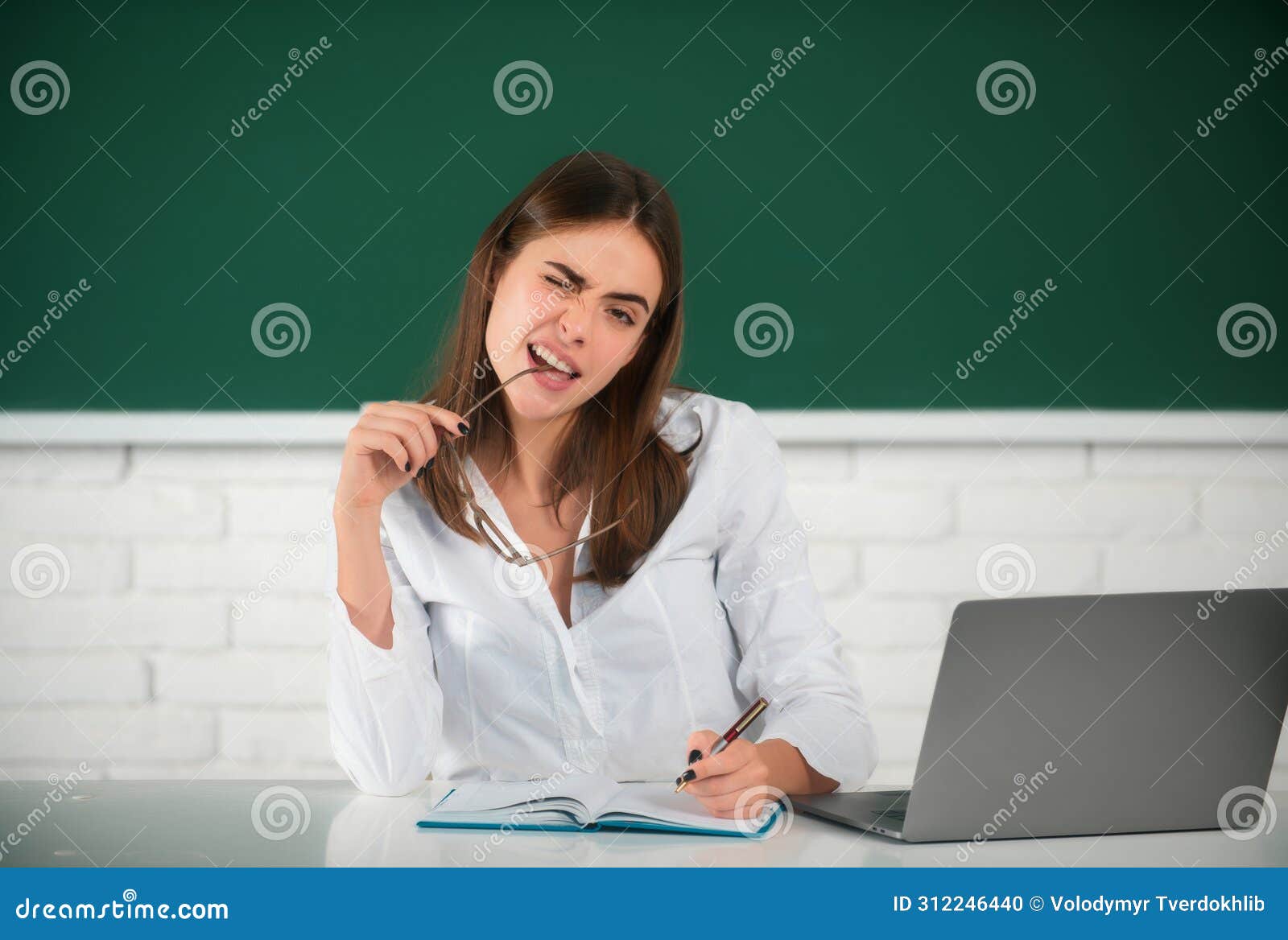 Portrait of a Funny Female Student Studying in School Classroom. Female Freelancer or a Student ...