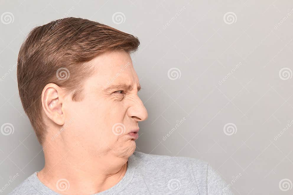 Portrait of Funny Man Grimacing from Disgust and Squeamishness Stock ... Portrait of Funny Man Grimacing from Disgust and Squeamishness Stock ...