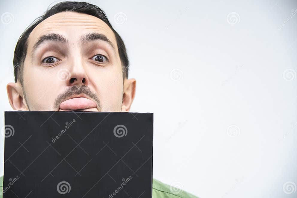 Portrait Of Funny Mid Adult Caucasian Businessman Grimacing And Mocking
