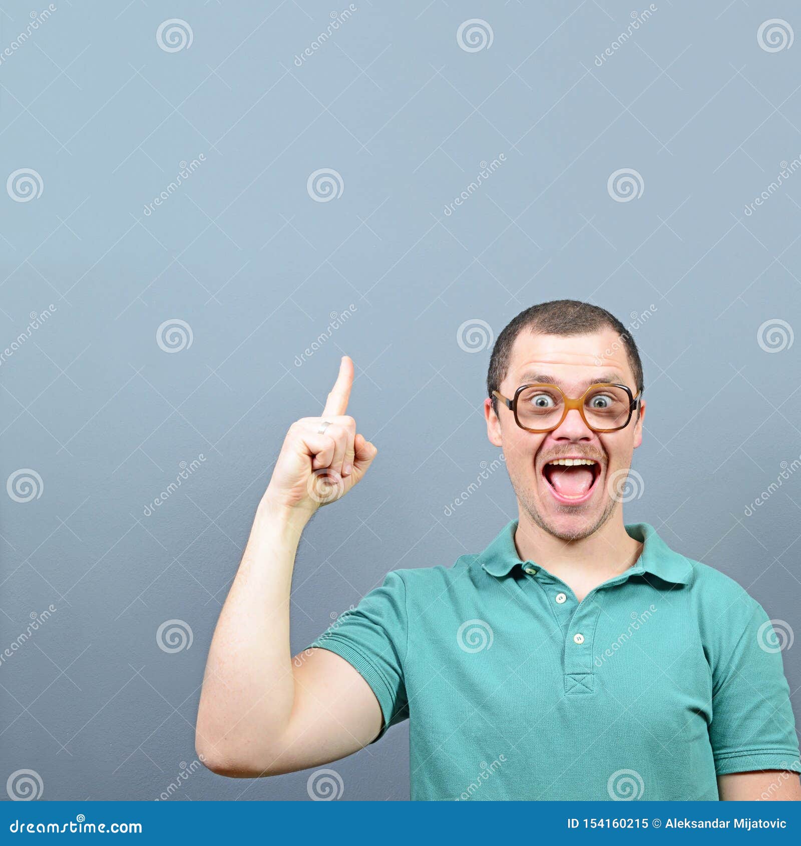 Portrait of Funny Nerd Guy Having an Idea and Showing at Empty Space ...