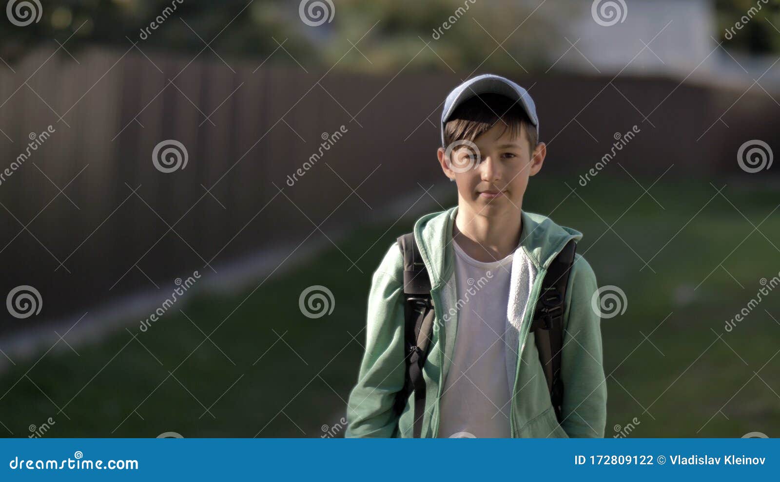 Portrait of a Funny School Boy with Backpack Looking at the Camera and ...