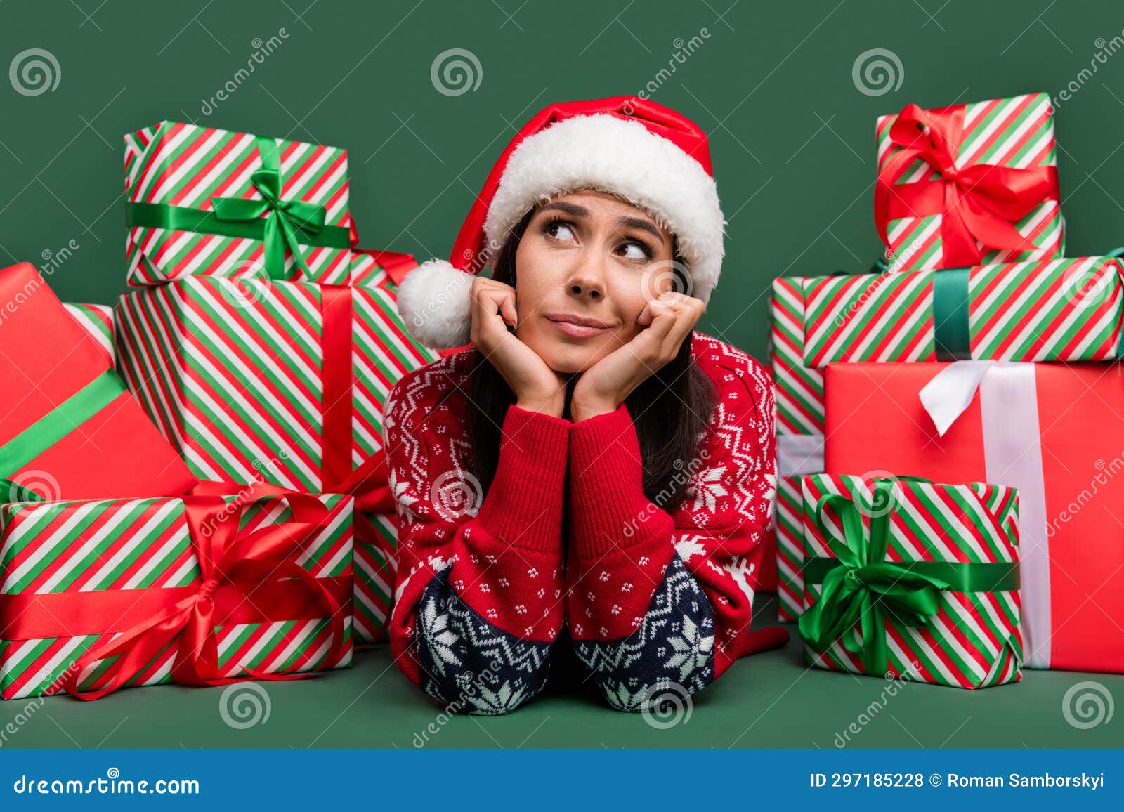 Portrait Of Funny Thoughtful Young Girl Santa Claus Helper Touch Cheeks