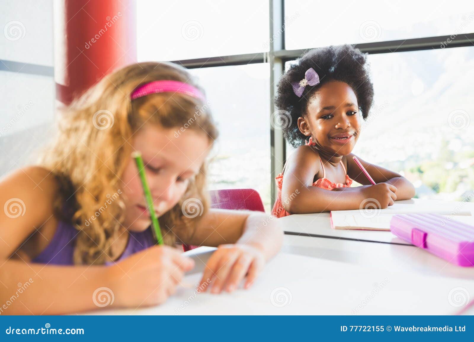 Portrait of Girl Doing Homework in Classroom Stock Image - Image of ...