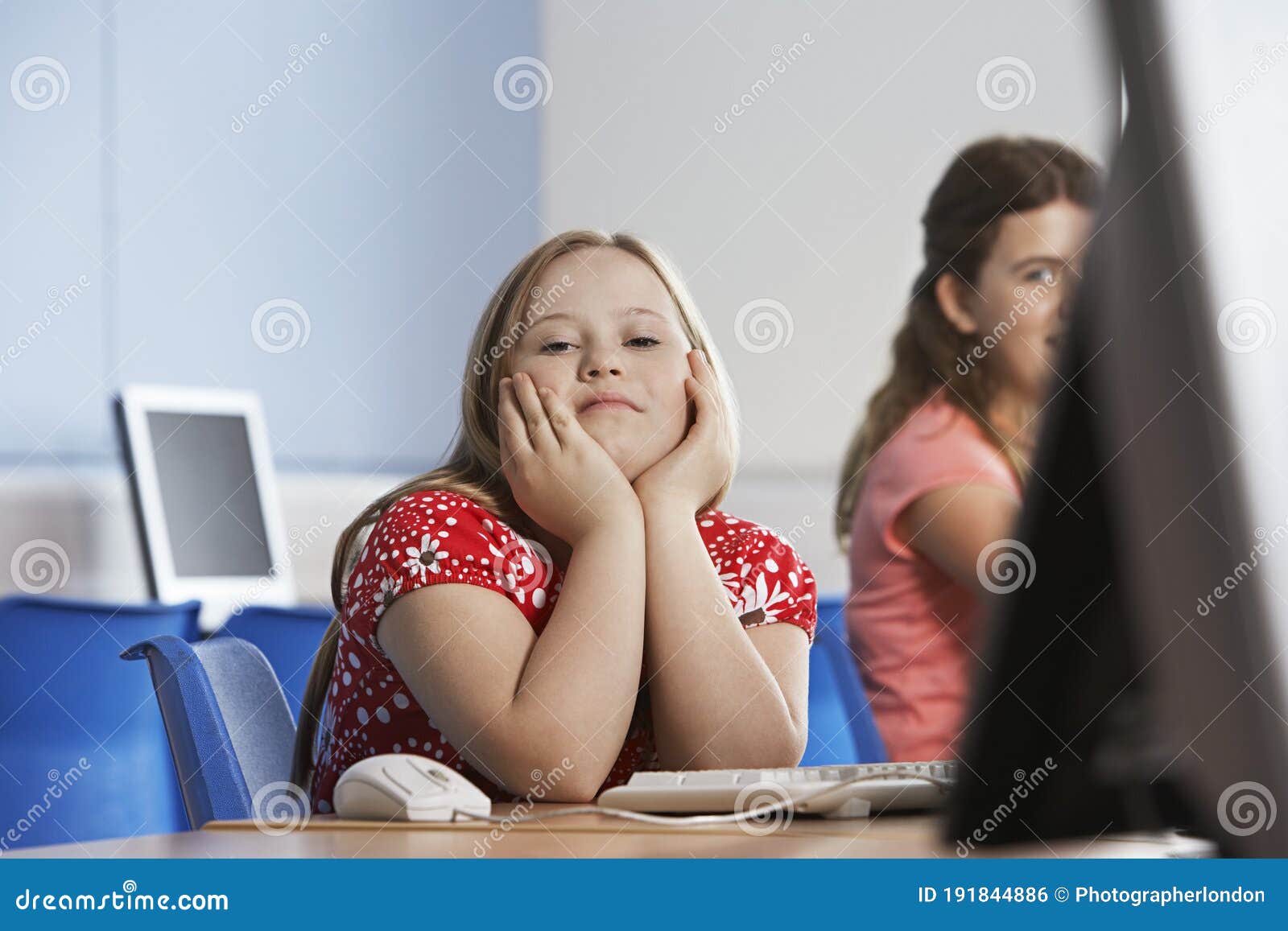 Portrait of Girl (10-12) with Down Syndrome in Computer Lab Stock Photo ...