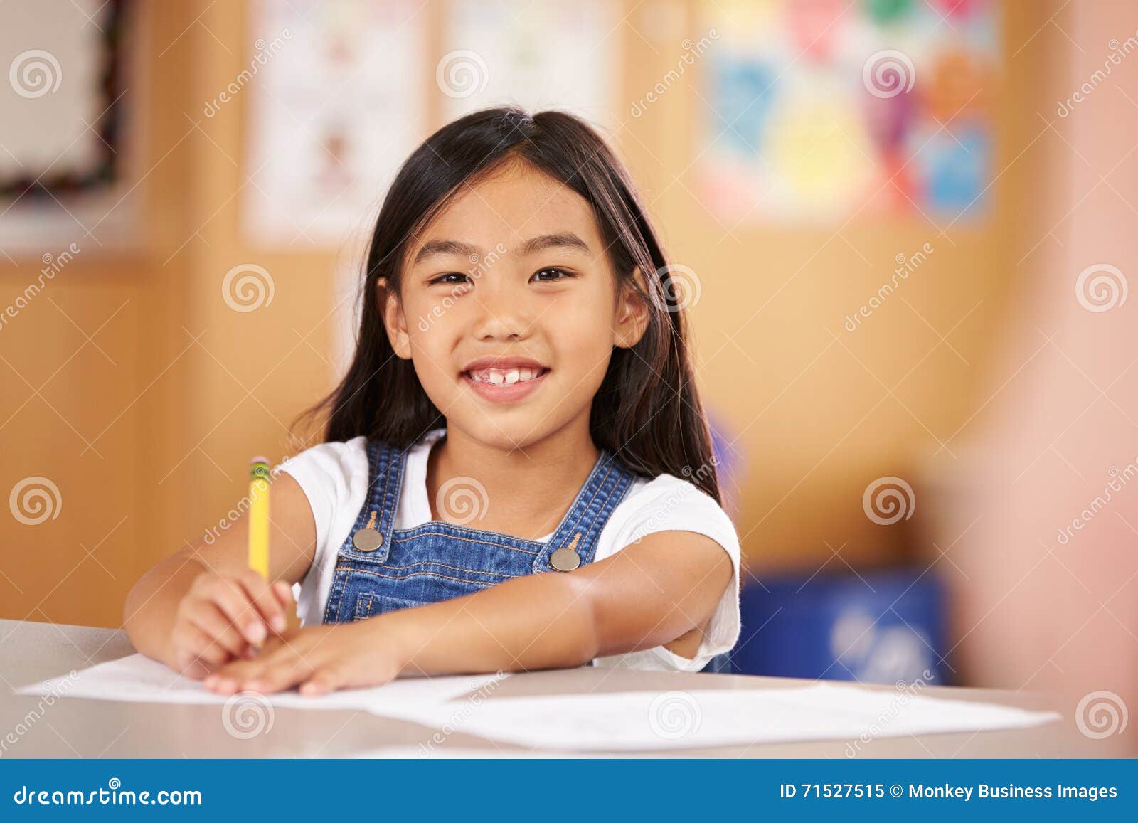 Portrait of a Girl at Elementary School Sitting in Classroom Stock ...