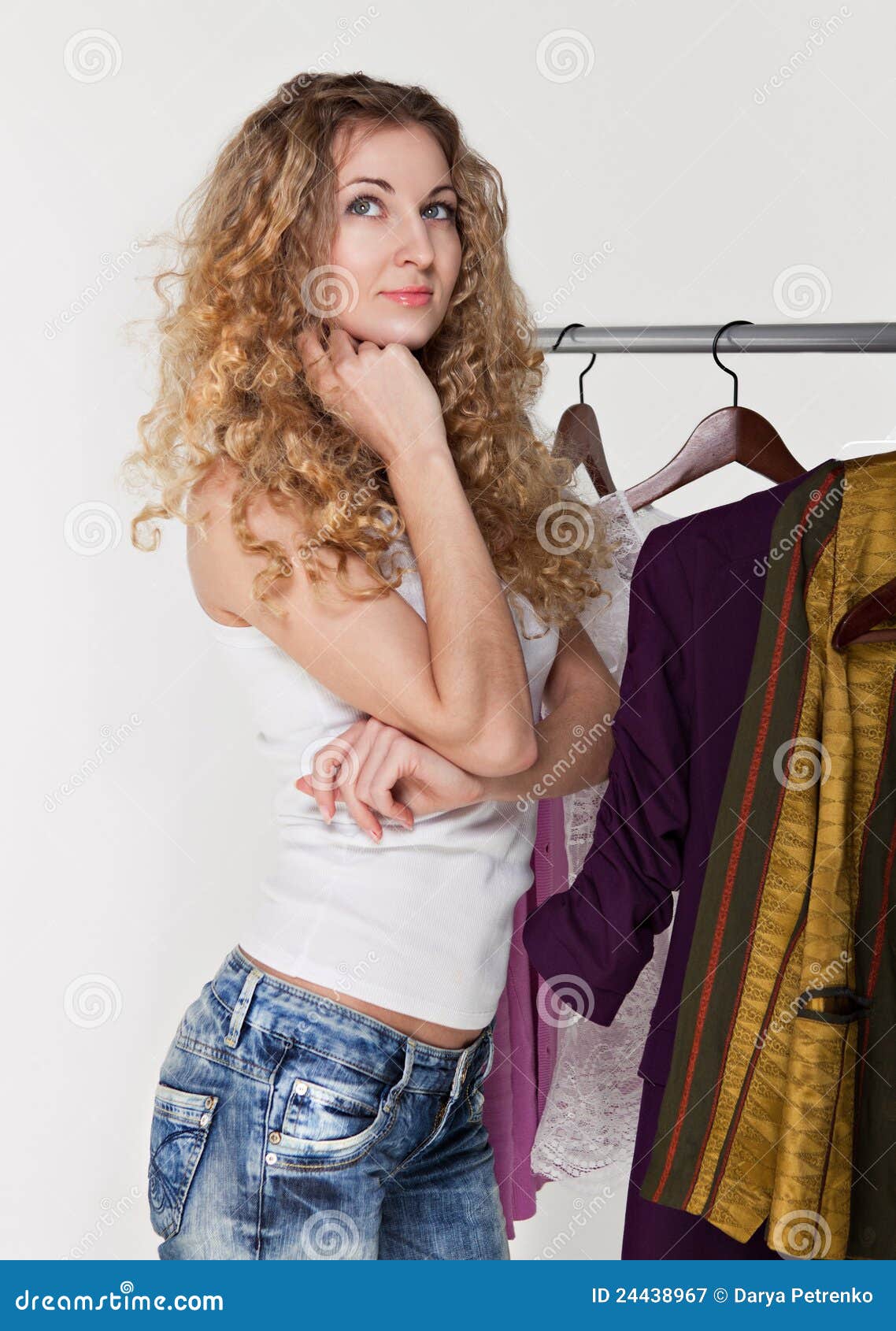 Portrait of a Girl Selecting Clothes Stock Image - Image of hanging ...