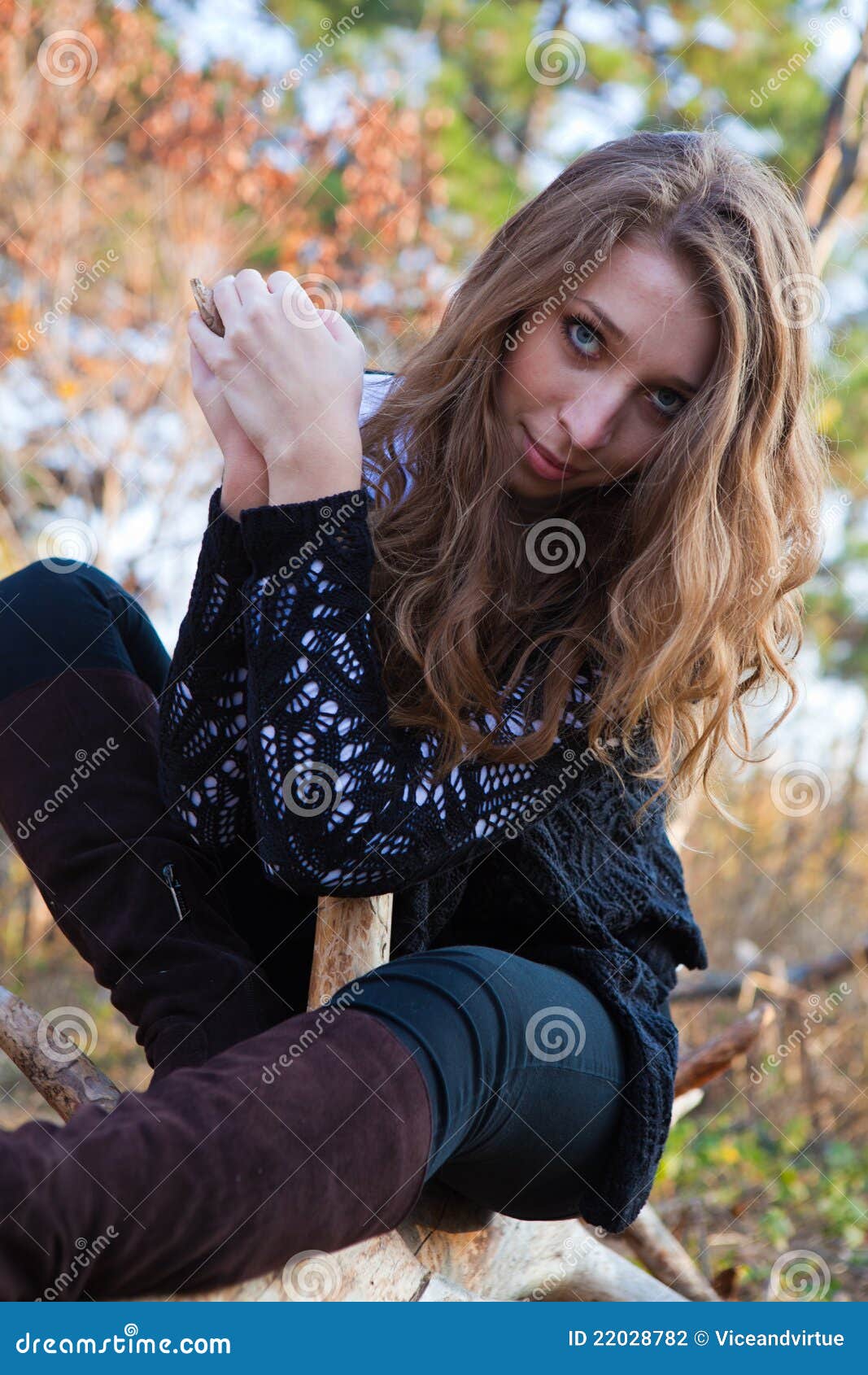 Portrait of a Girl Sitting on a Log Stock Photo - Image of person ...