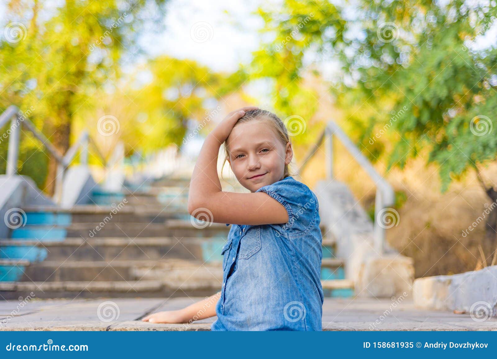 Portrait of a Girl Sitting in the Park on the Steps Stock Image - Image ...