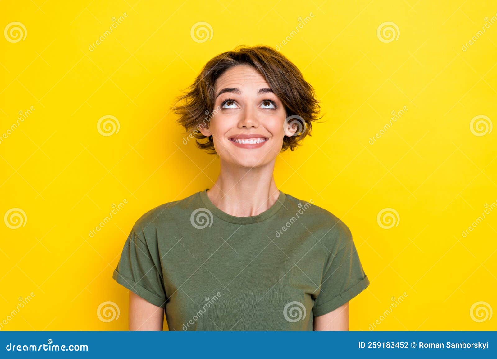 Portrait Of Glad Impressed Woman With Bob Hairdo Dressed Khaki T Shirt