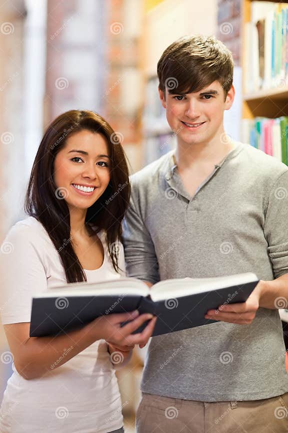 Portrait of Good Looking Students with a Book Stock Image - Image of ...