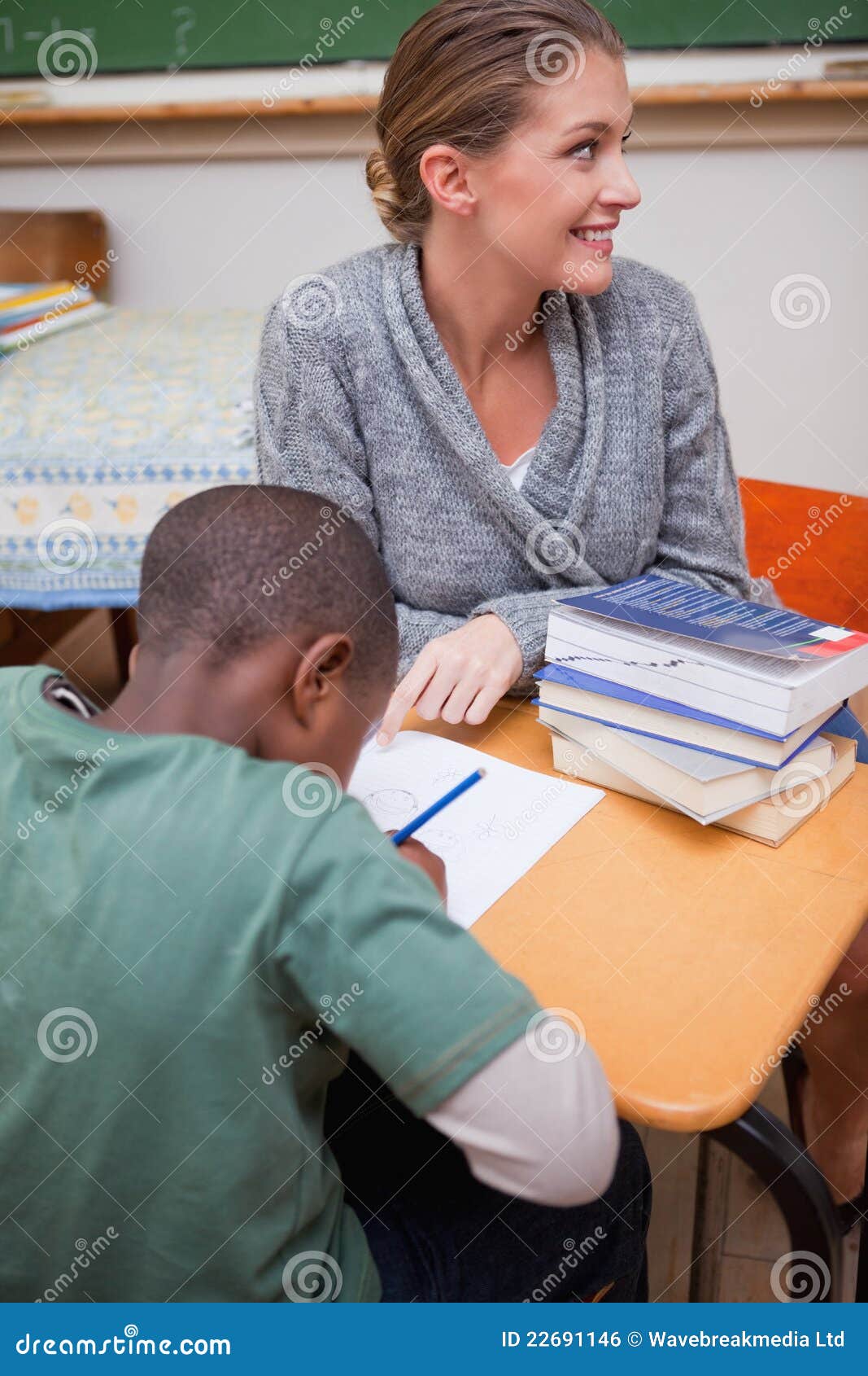 Portrait of a Good Looking Teacher Explaining Something To a Pup Stock ...