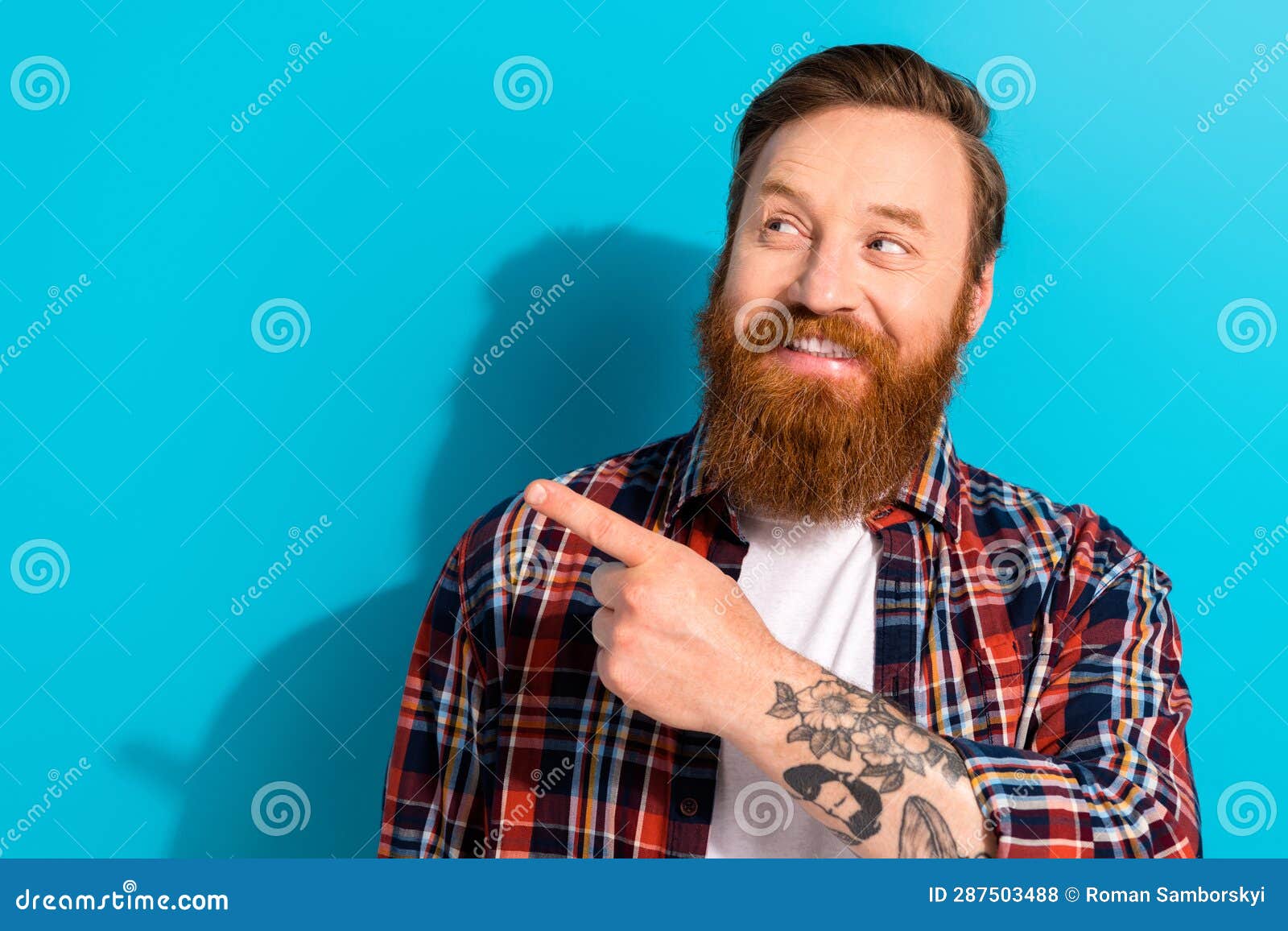 Portrait Of Good Mood Satisfied Man With Tattoo Wear Plaid Shirt