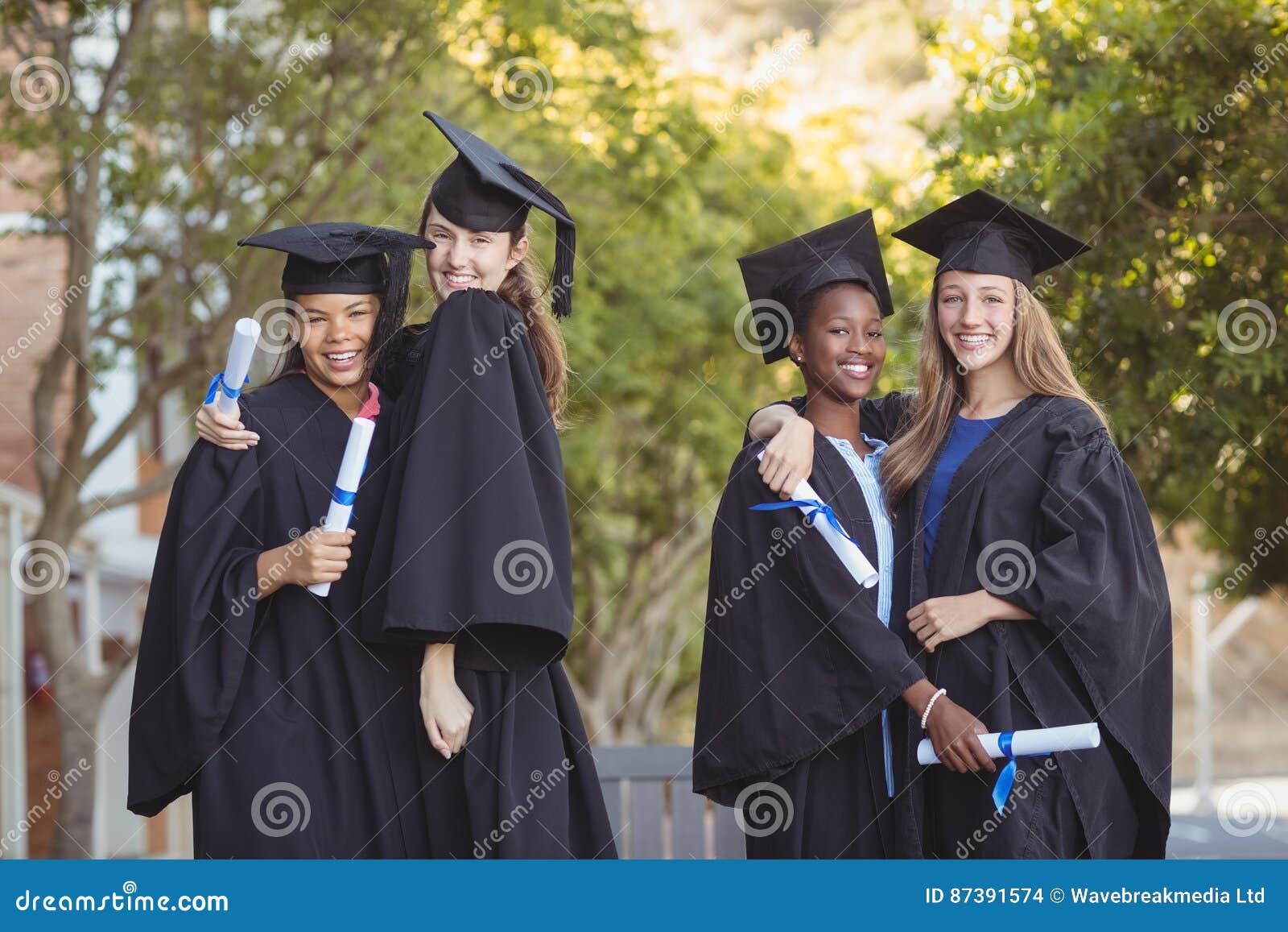 Portrait of Graduate School Kids Standing with Degree Scroll in Campus ...