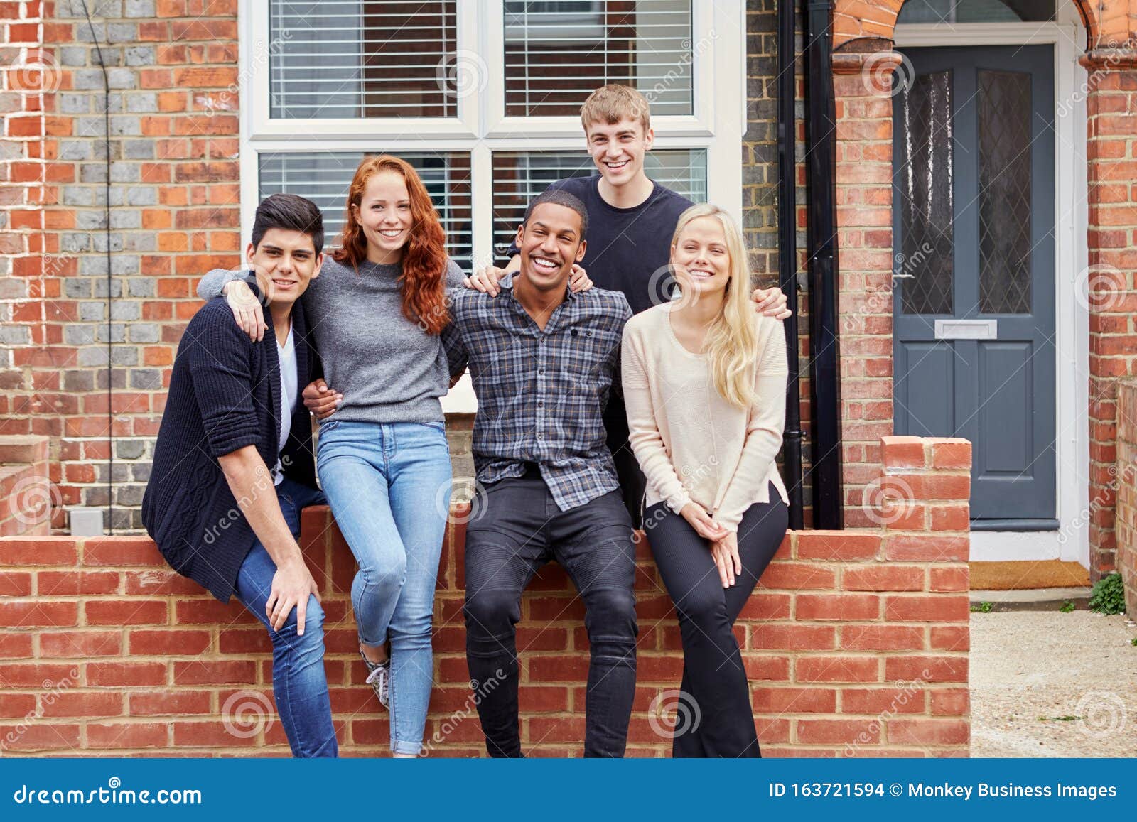 Portrait of Group of Smiling College Students Outside Rented Shared ...