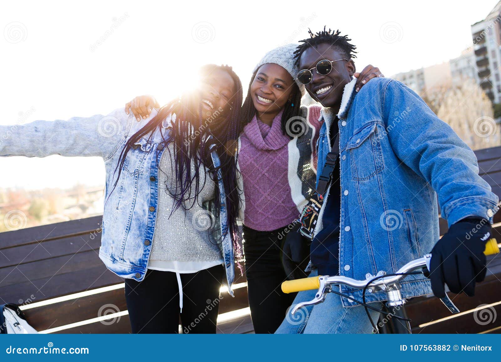 Group of Three Friends Looking at Camera in the Street. Stock Photo ...