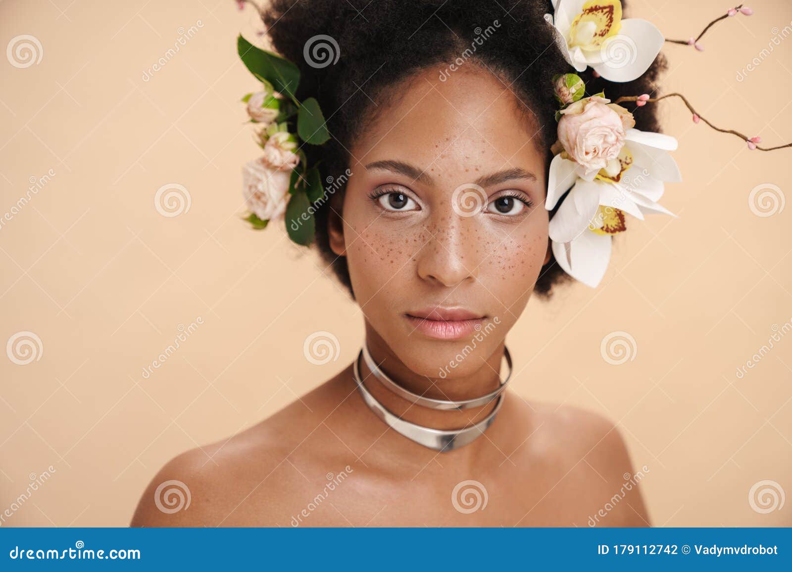 Portrait Of Half Naked African American Woman With Flowers In Her Hair