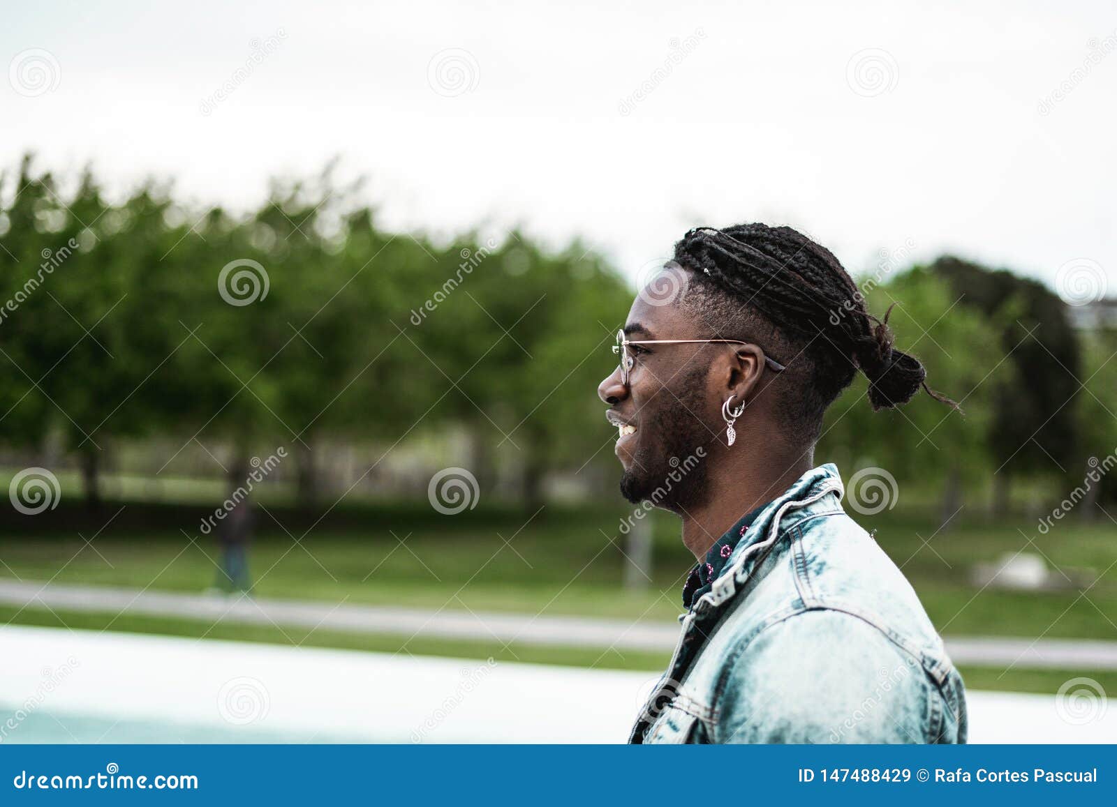 Portrait Of Handsome African American Man Smiling In The Street With