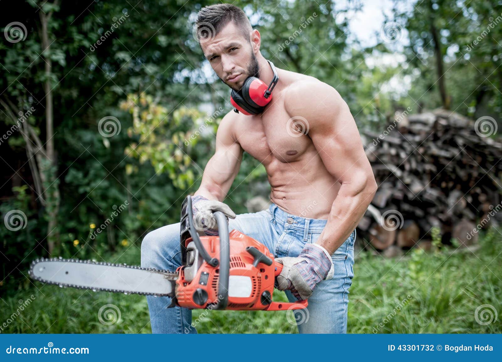 Portrait of Handsome Athletic Man with Chainsaw and Protective Stock ...