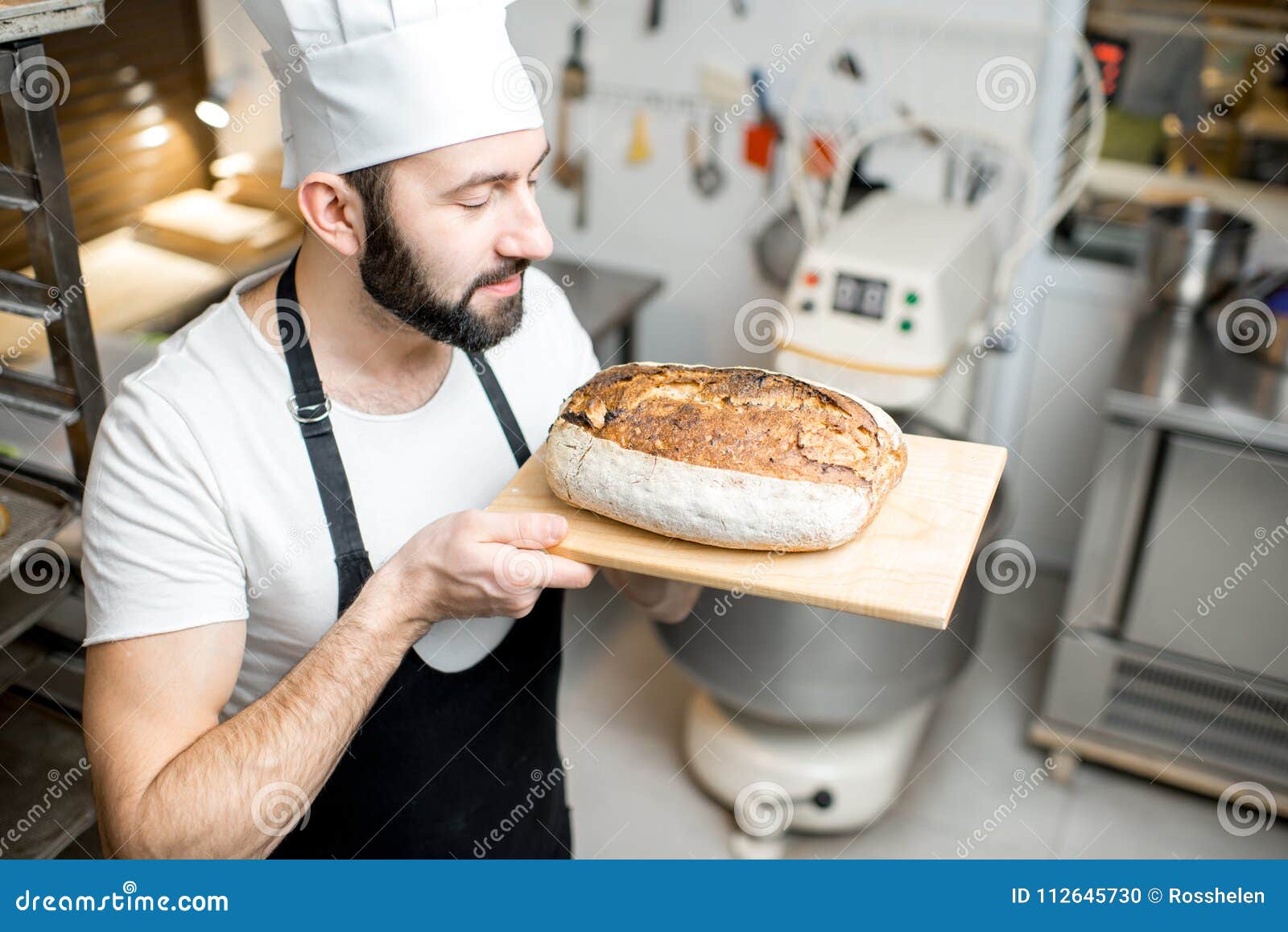 Baker with Bread in the Bakery Stock Photo - Image of delicious, baker ...