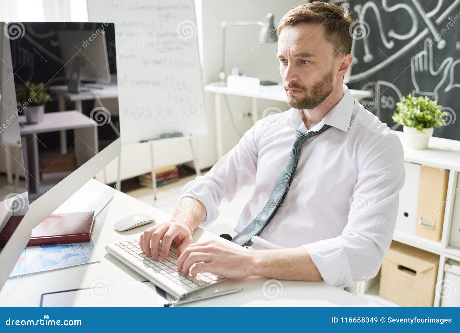 Handsome Businessman Typing in Office Stock Image - Image of ...