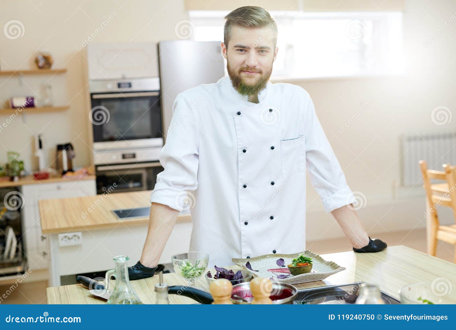 Handsome Chef Posing in Kitchen Stock Photo - Image of looking, camera ...