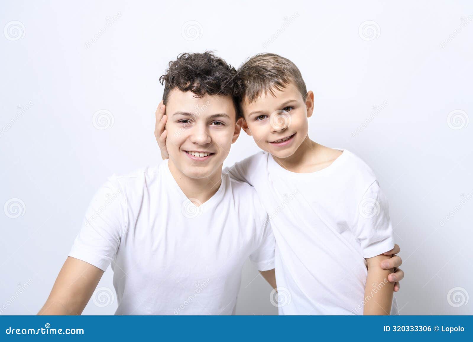 Portrait of Handsome Brother Posing Near the White Wall Stock Photo ...