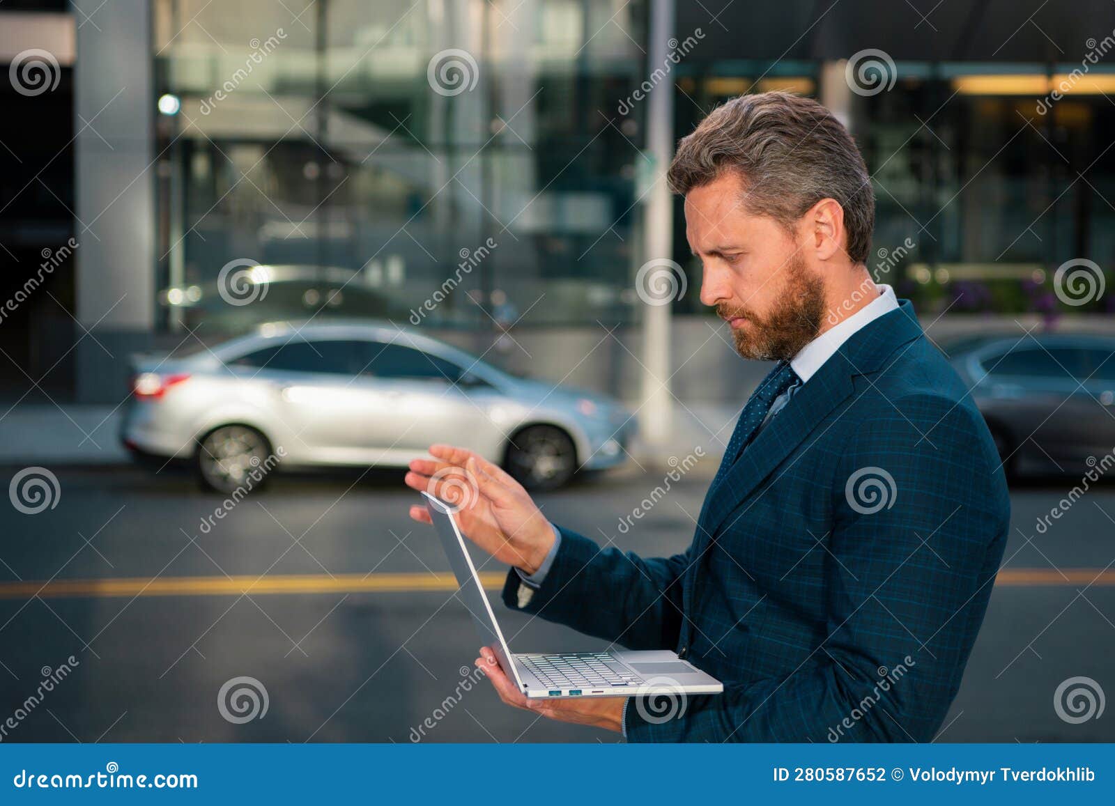 Portrait of Handsome Business Man Using Laptop Outdoor. Stock Photo ...