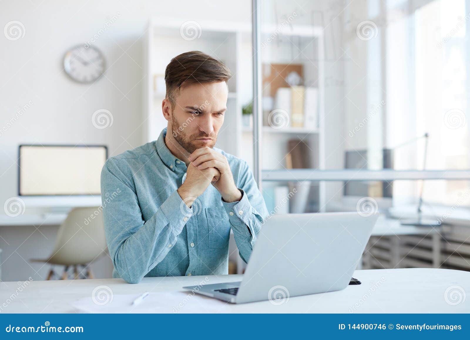 Pensive Young Man Using Laptop Stock Photo - Image of businessman ... Pensive Young Man Using Laptop Stock Photo - Image of businessman ...