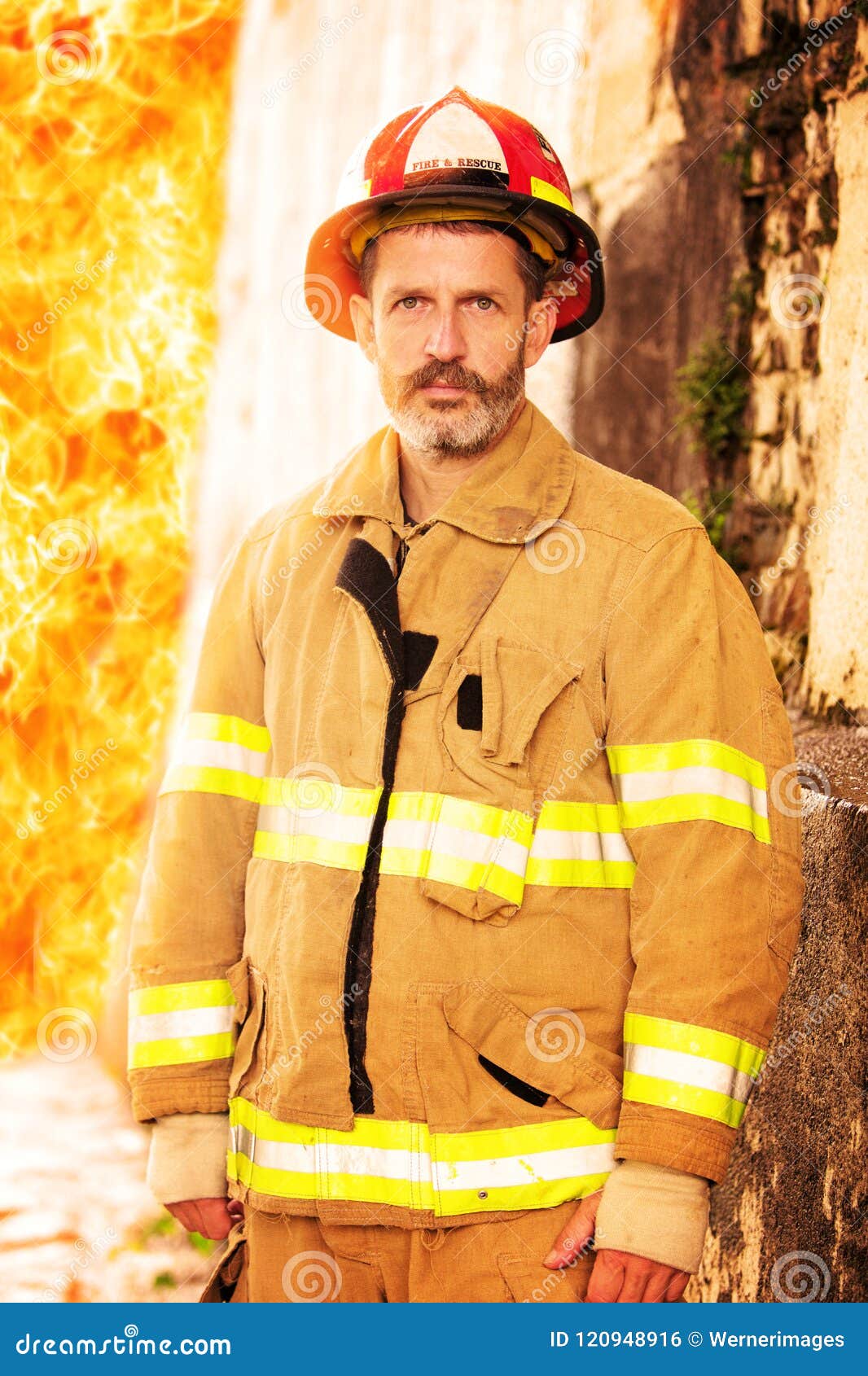 Fireman Standing in Front of Wall of Fire Stock Photo - Image of ...