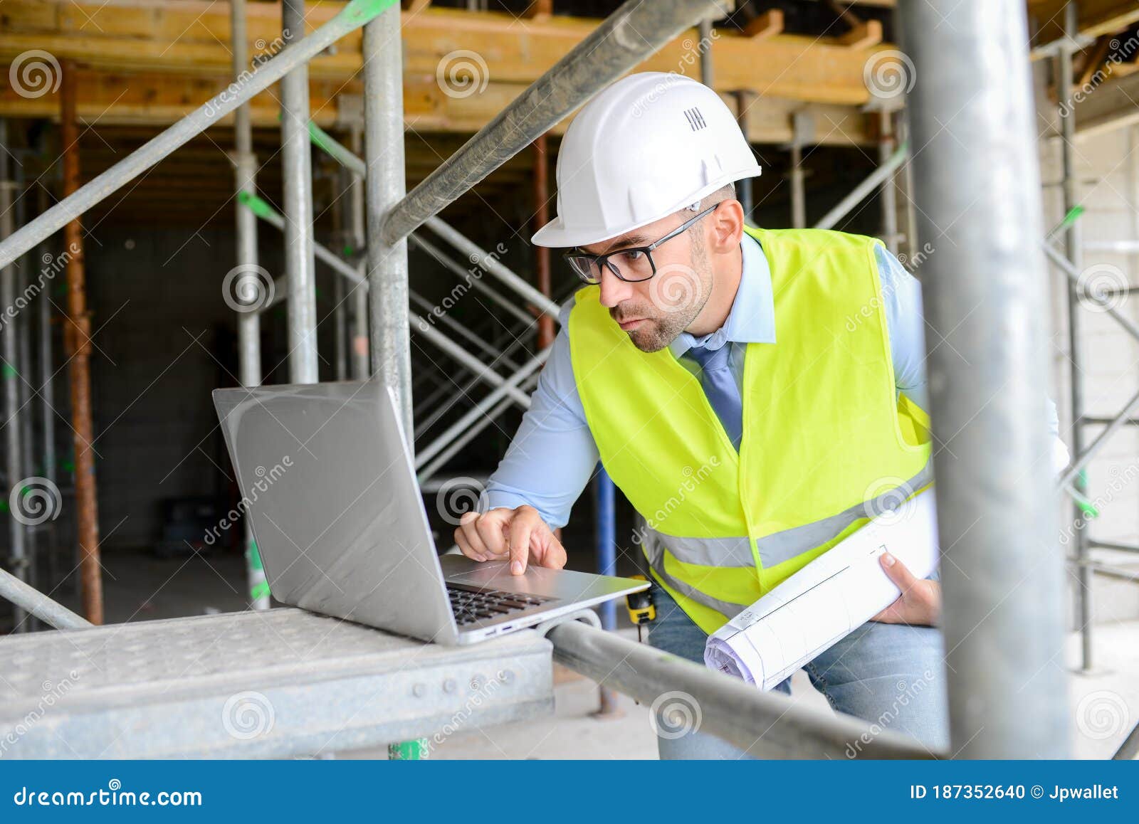 Foreman At Construction Site With Working Drawings Royalty-Free Stock ...