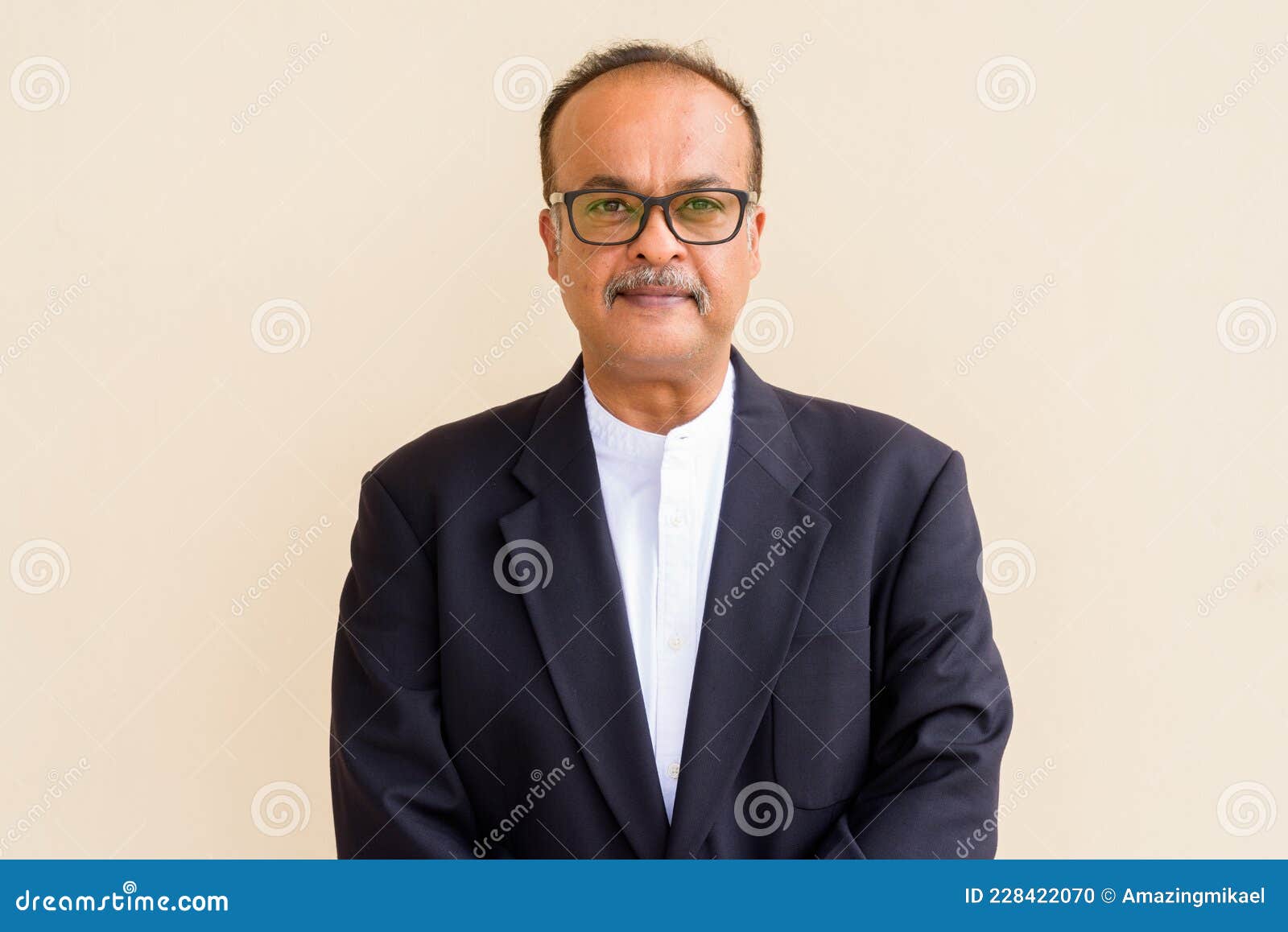 Portrait of Handsome Indian Man with Mustache Against Plain Wall Stock ...