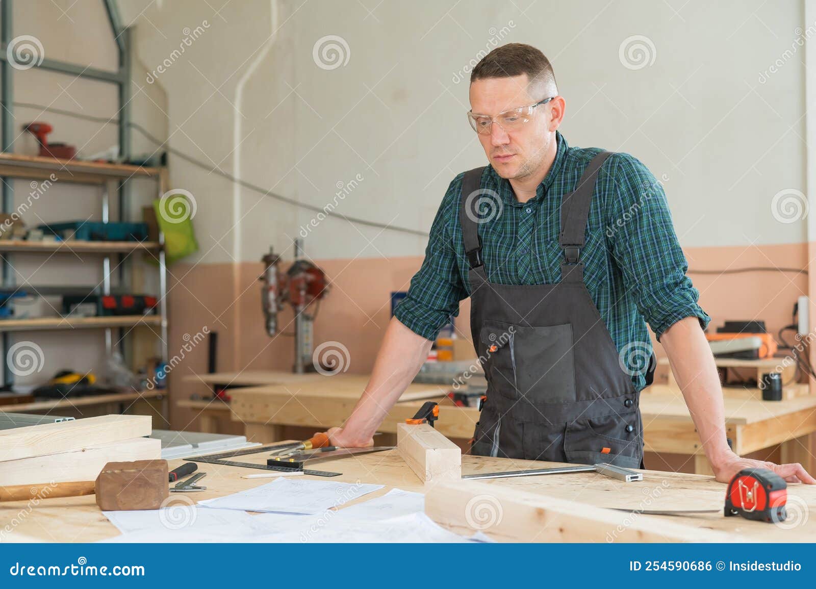 Portrait of a Handsome Male Carpenter in the Workshop. Stock Photo ...
