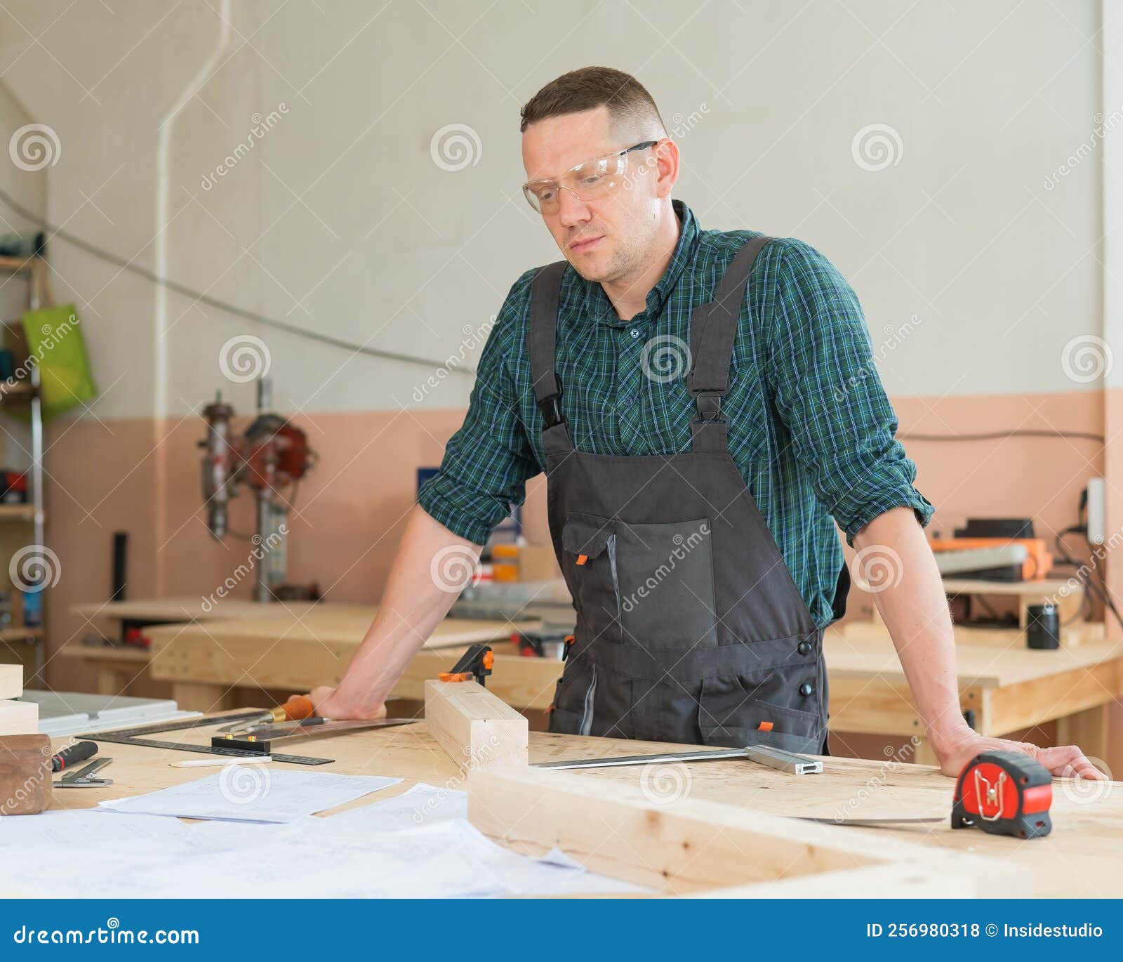 Portrait of a Handsome Male Carpenter in the Workshop. Stock Photo ...