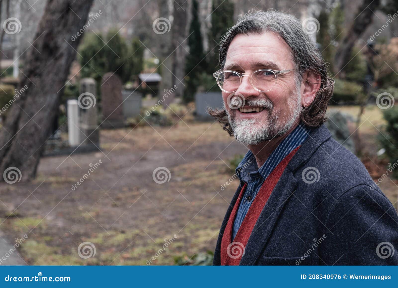 Handsome Man in His 50s in Cemetery Outside Smiling Stock Photo - Image ...