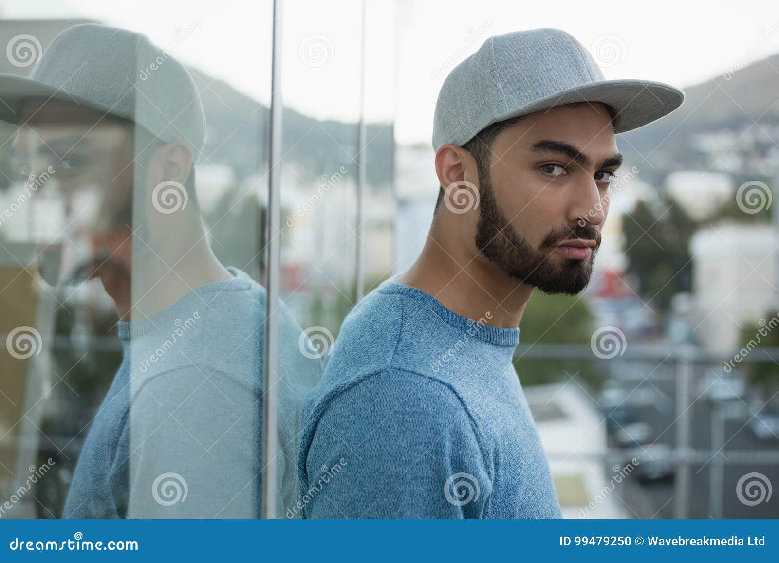 Handsome Man Leaning on Glass Stock Photo - Image of modern, lifestyle ...