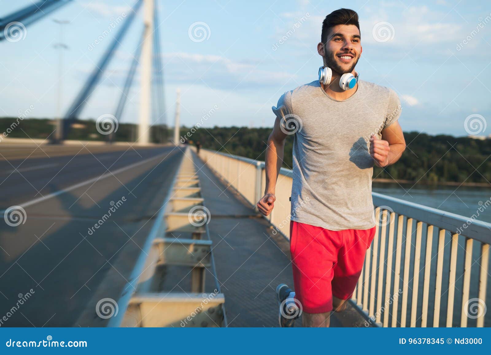 Portrait of Handsome Man Running on Bridge Stock Image - Image of ...