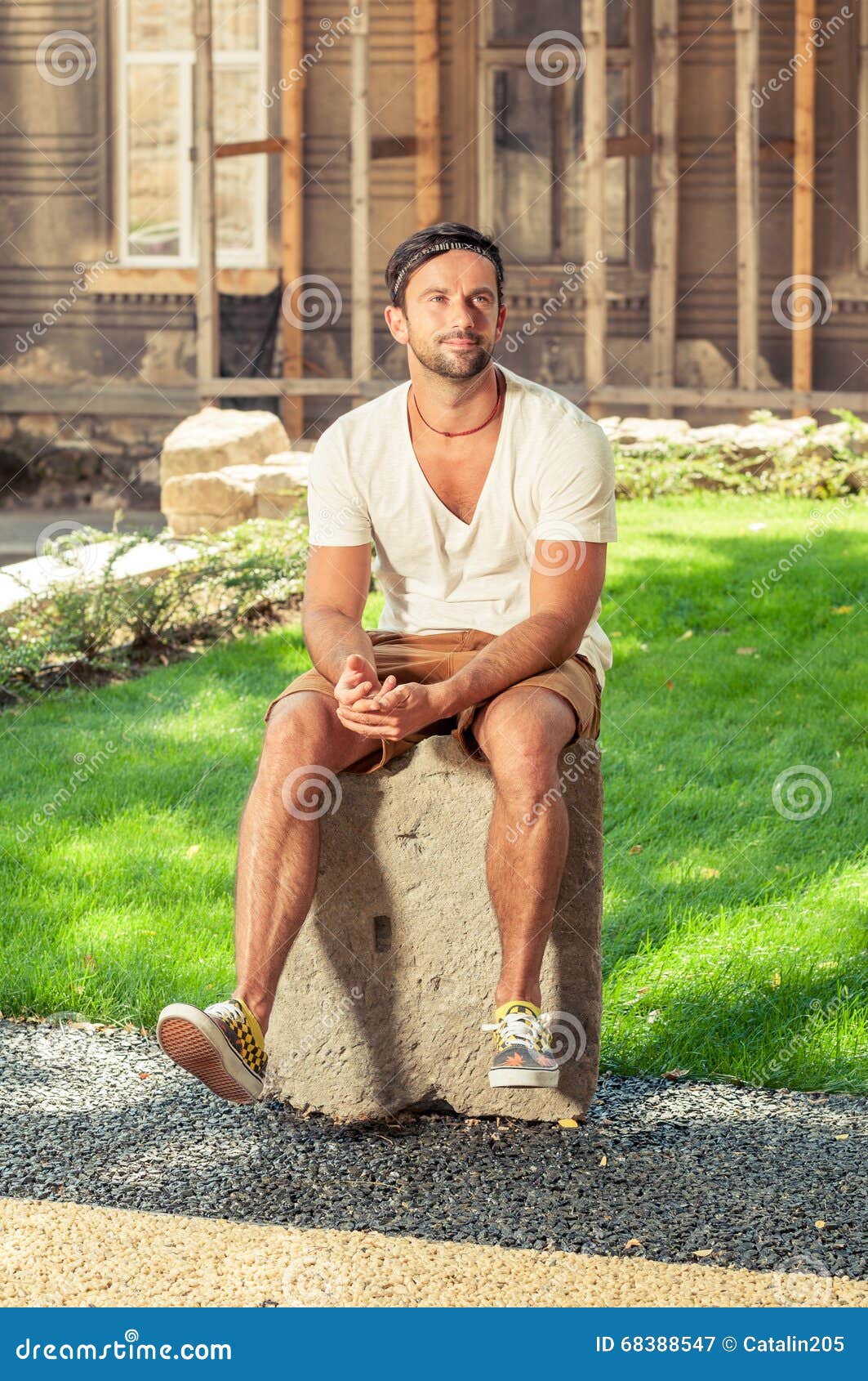 Portrait of Handsome Man Sitting Down on Stone Stock Image - Image of ...