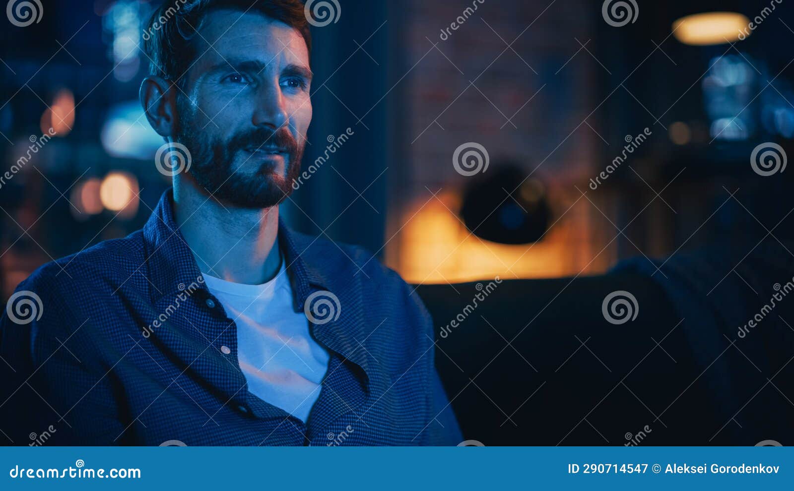 Portrait Of Handsome Man Spending Time At Home Resting On A Couch