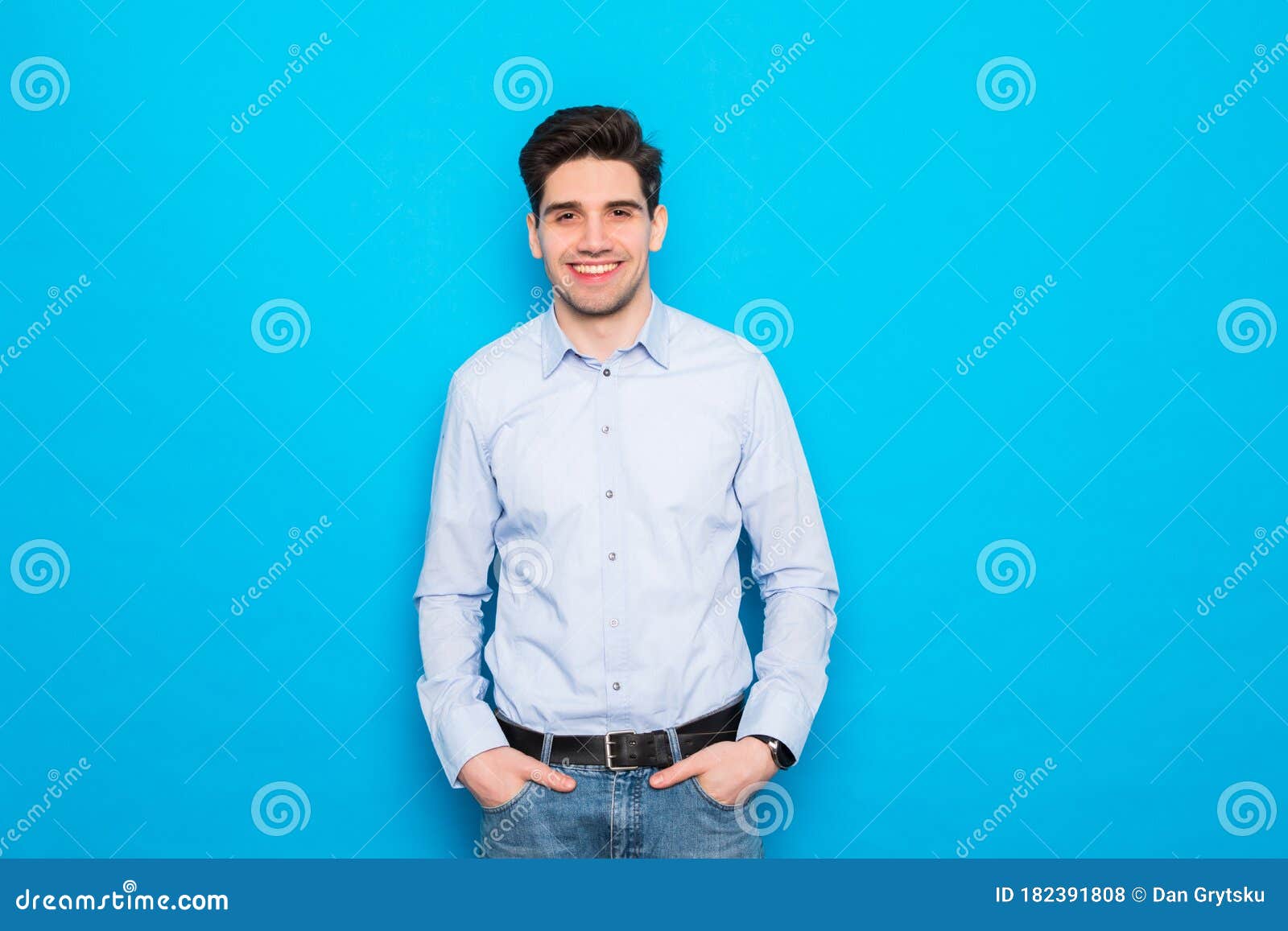 Portrait of Handsome Man Standing Isolated on Blue Background Stock ...
