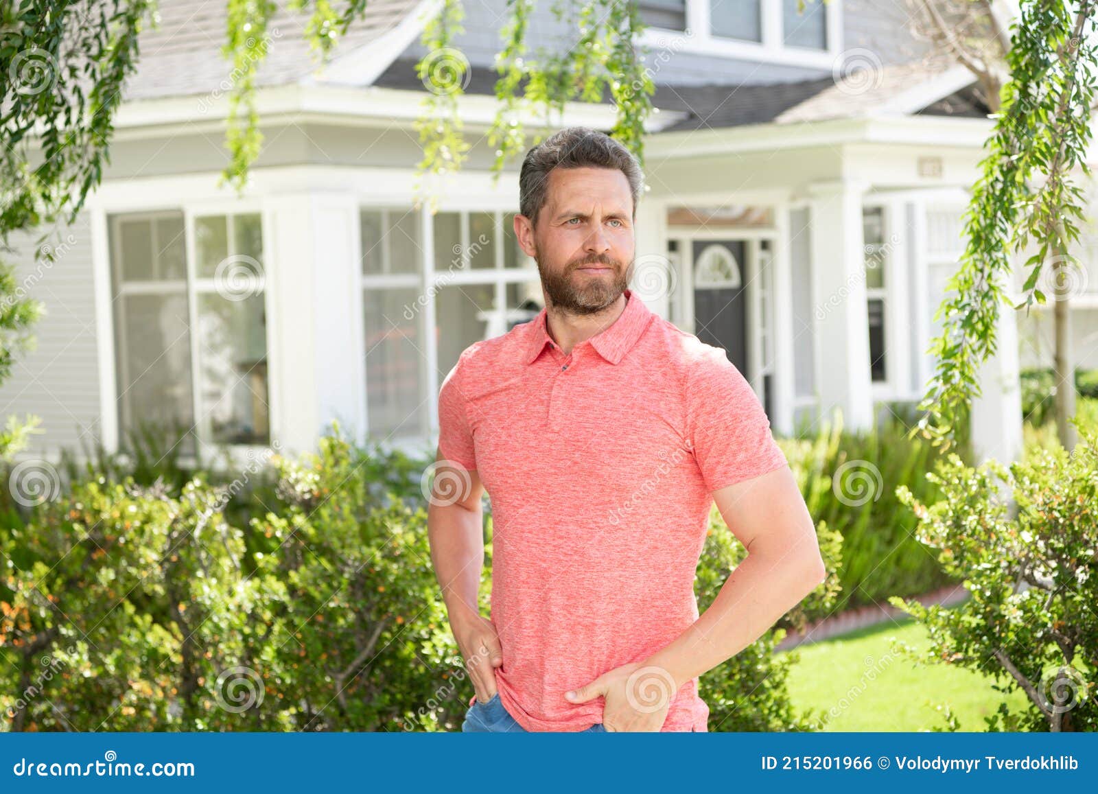 Portrait of Handsome Man Standing Outside New Home. Stock Photo - Image ...