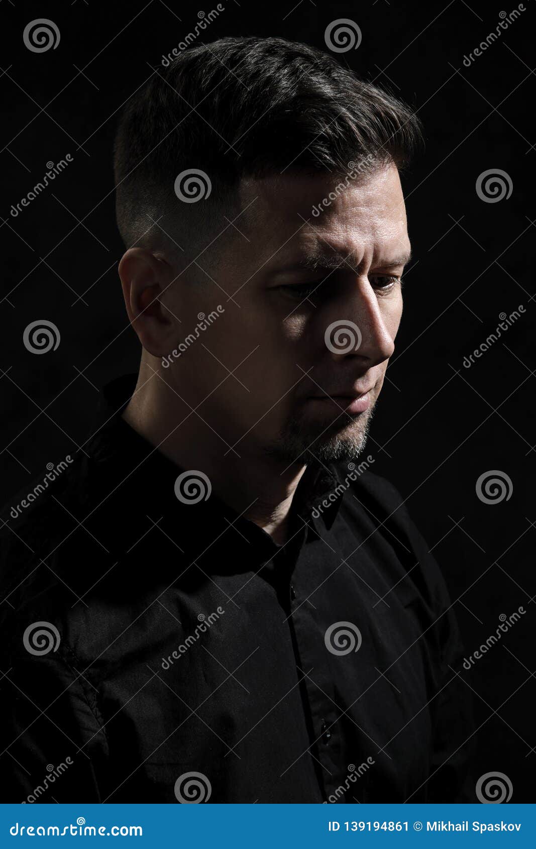 Portrait of a Handsome Man 40 Years Old on a Dark Artistic Background ... Portrait of a Handsome Man 40 Years Old on a Dark Artistic Background ...
