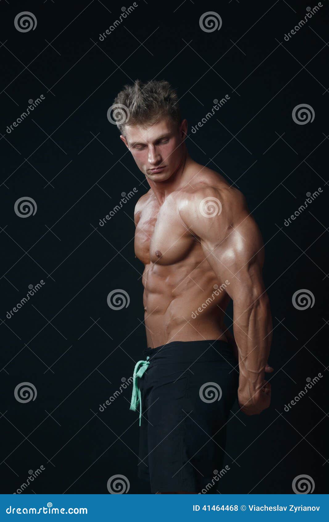 Portrait of a Handsome Muscular Bodybuilder Posing Over Black Ba Stock ...