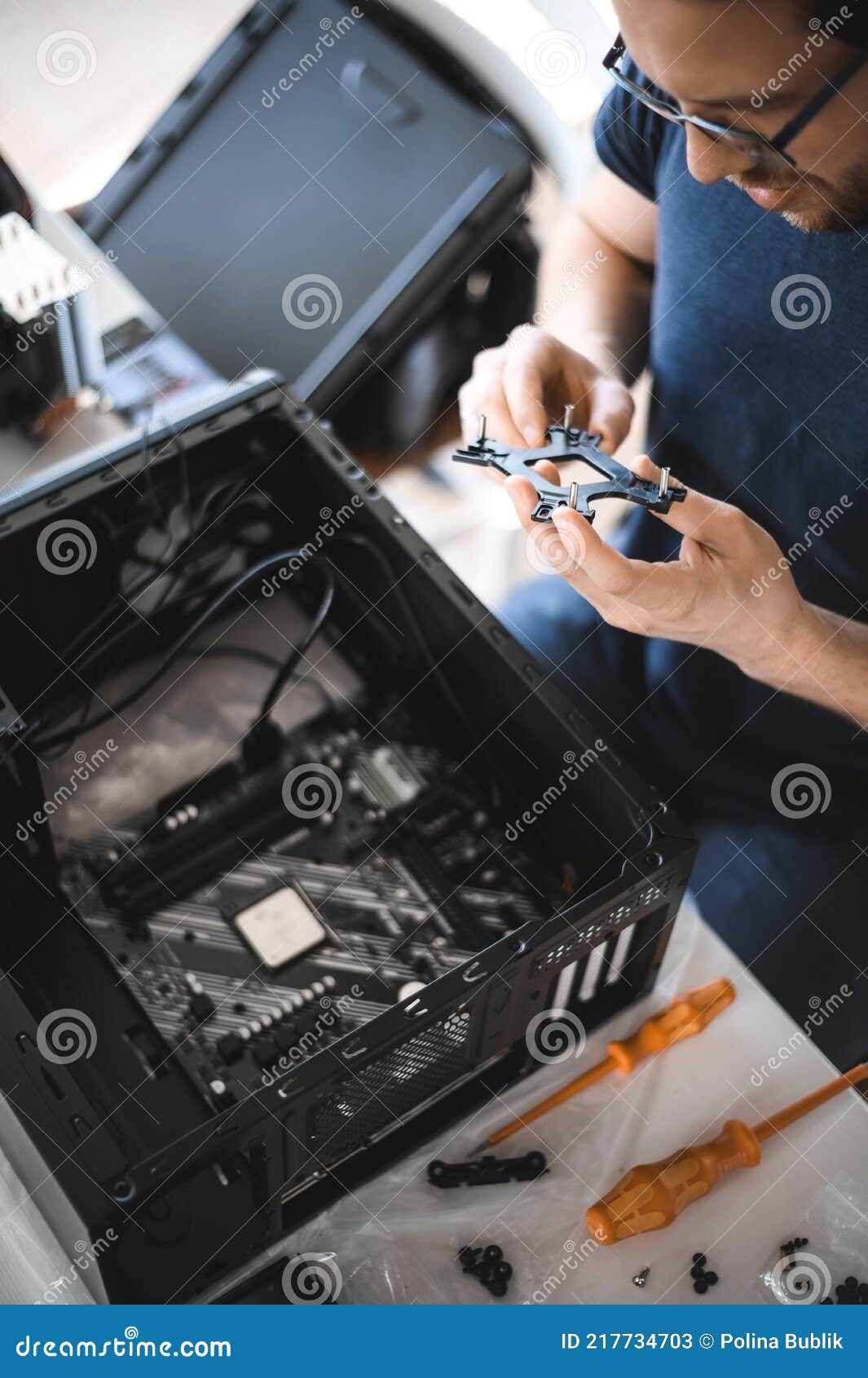 Handsome Nerd Man is Servicing Computer Motherboard and Cooler. Stock ...
