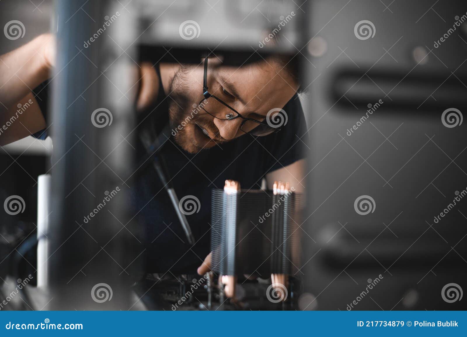 Handsome Nerd Man is Servicing Computer Motherboard and Cooler. Stock ...