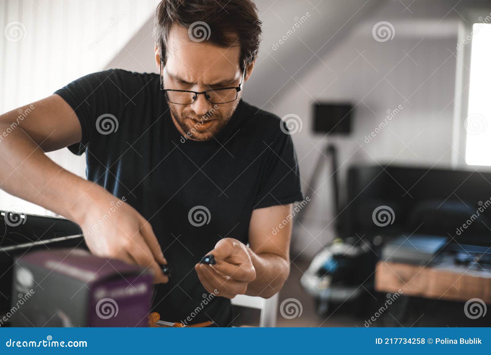 Handsome Nerd Man is Servicing Computer Motherboard and Cooler. Stock ...