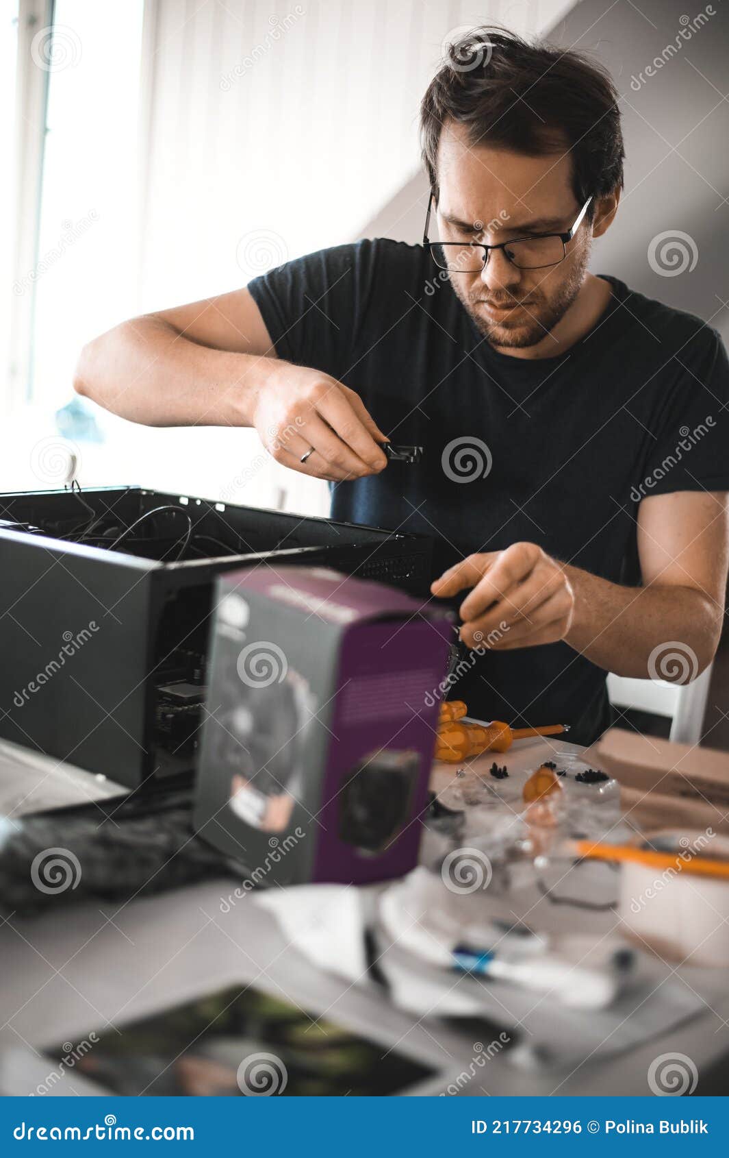Handsome Nerd Man is Servicing Computer Motherboard and Cooler. Stock ...