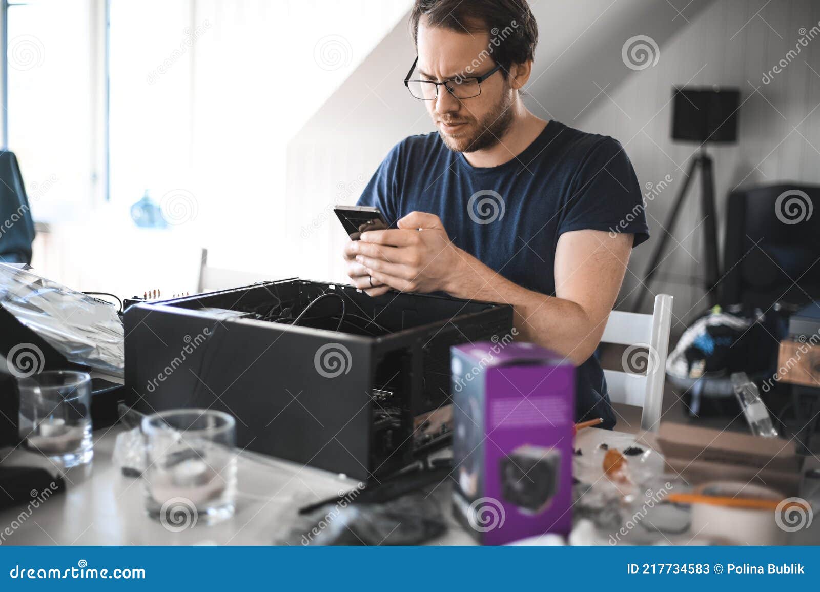 Handsome Nerd Man is Servicing Computer Motherboard and Cooler. Stock ...